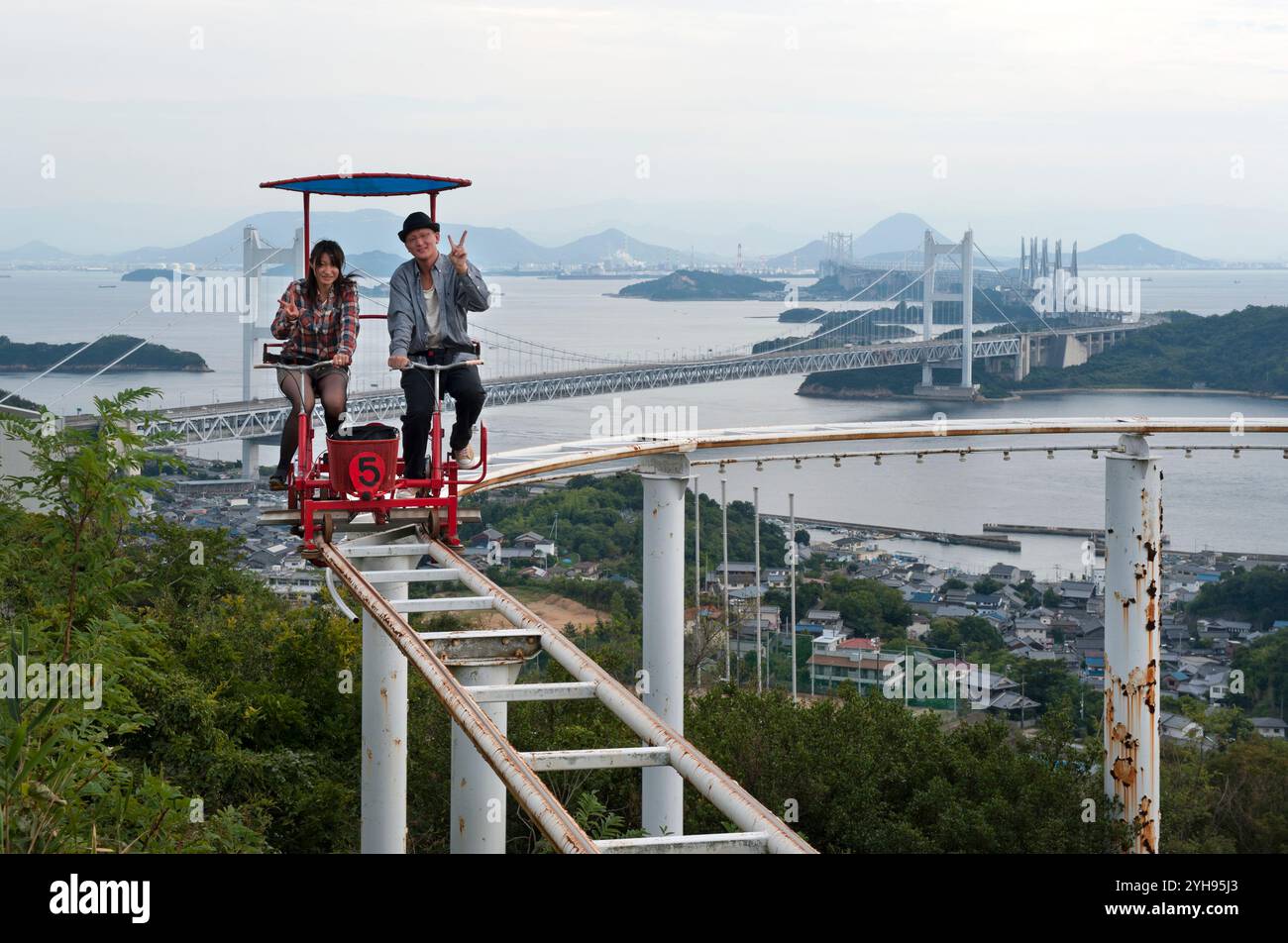 Visitors to Washuzan Highland amusement park enjoying exercise on the ...