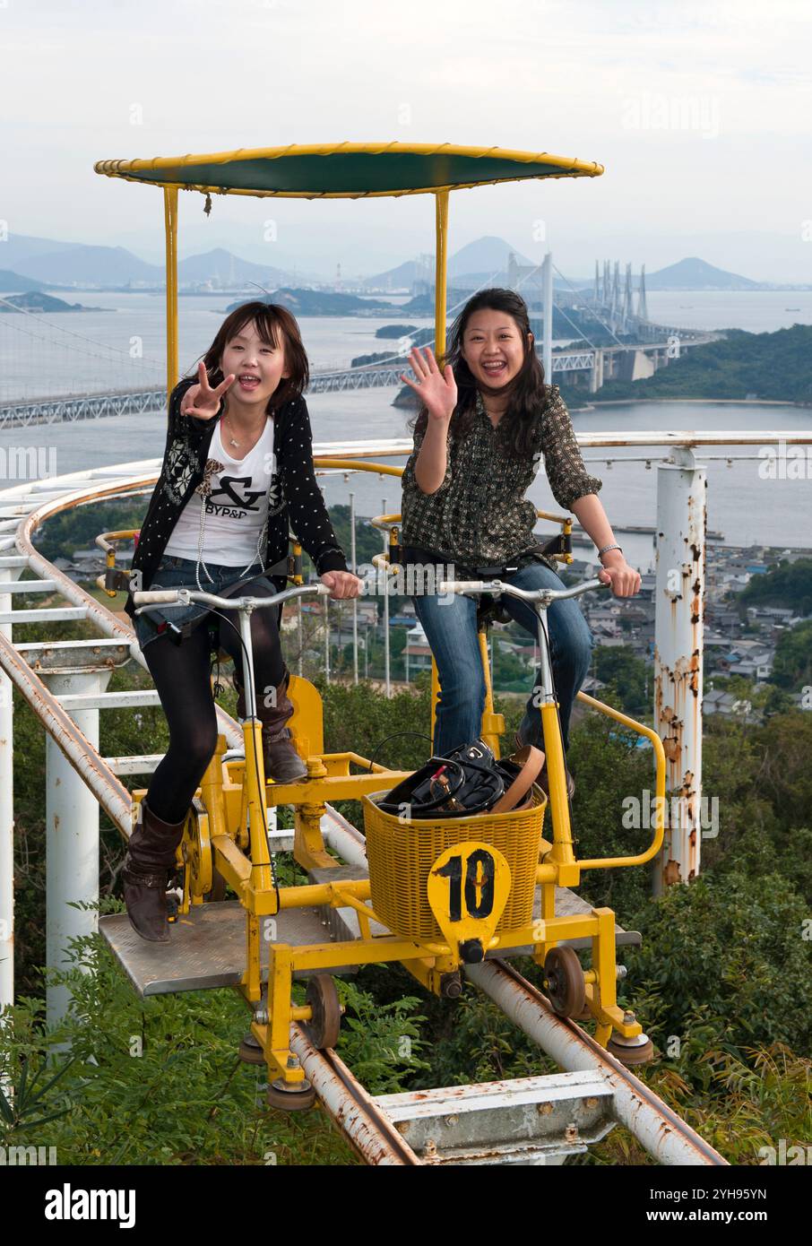 Visitors to Washuzan Highland amusement park enjoying exercise on the ...