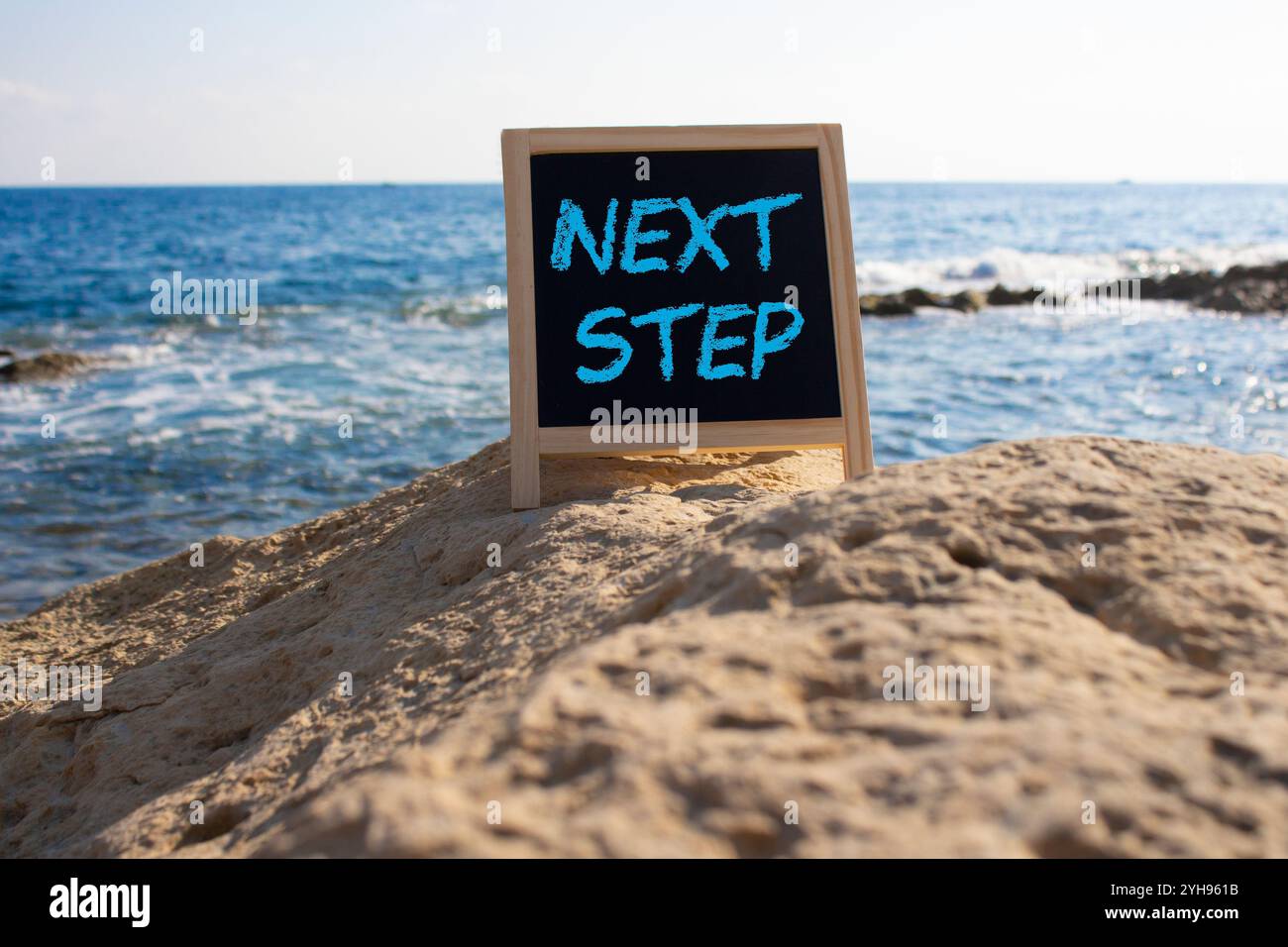 Next Step symbol. Concept words Next Step on black chalk background ...