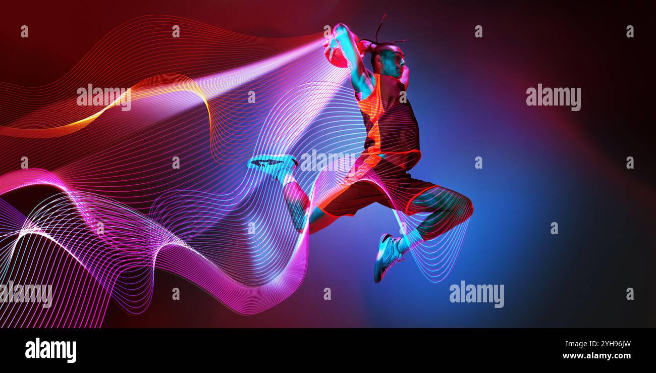 Dynamic image of young man, basketball player in motion during game ...