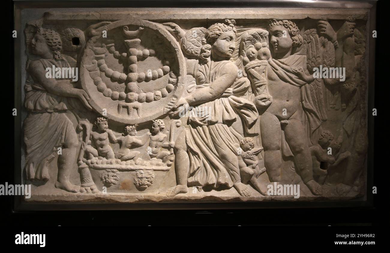 Jewish Seasons sarcophagus. Two standing Victories, flanked by a figure ...