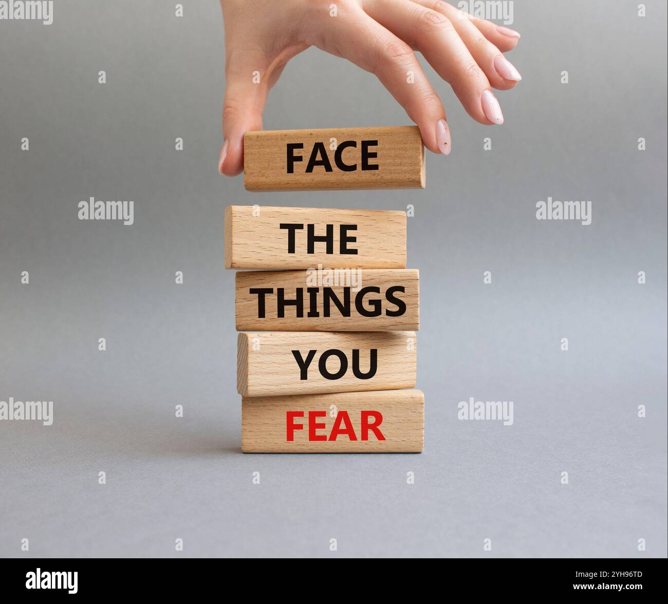 Face the things you fear symbol. Wooden blocks with words Face the ...