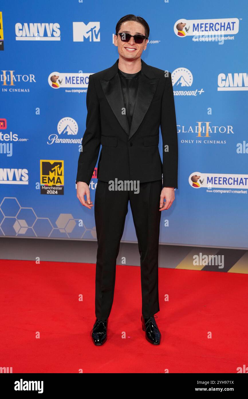 Peso Pluma poses for photographers upon arrival at the MTV European ...