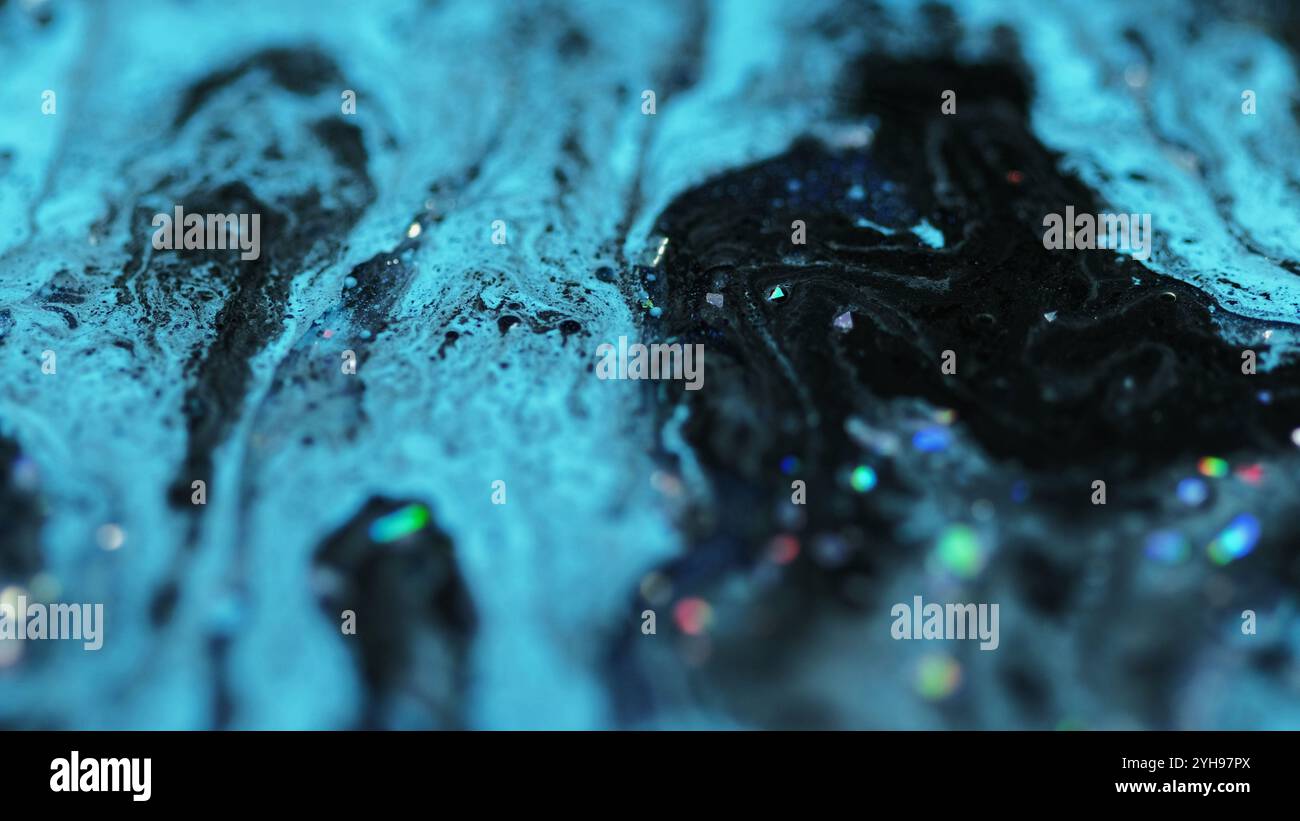 Liquid glitter texture. Ink drip. Defocused black blue color ...