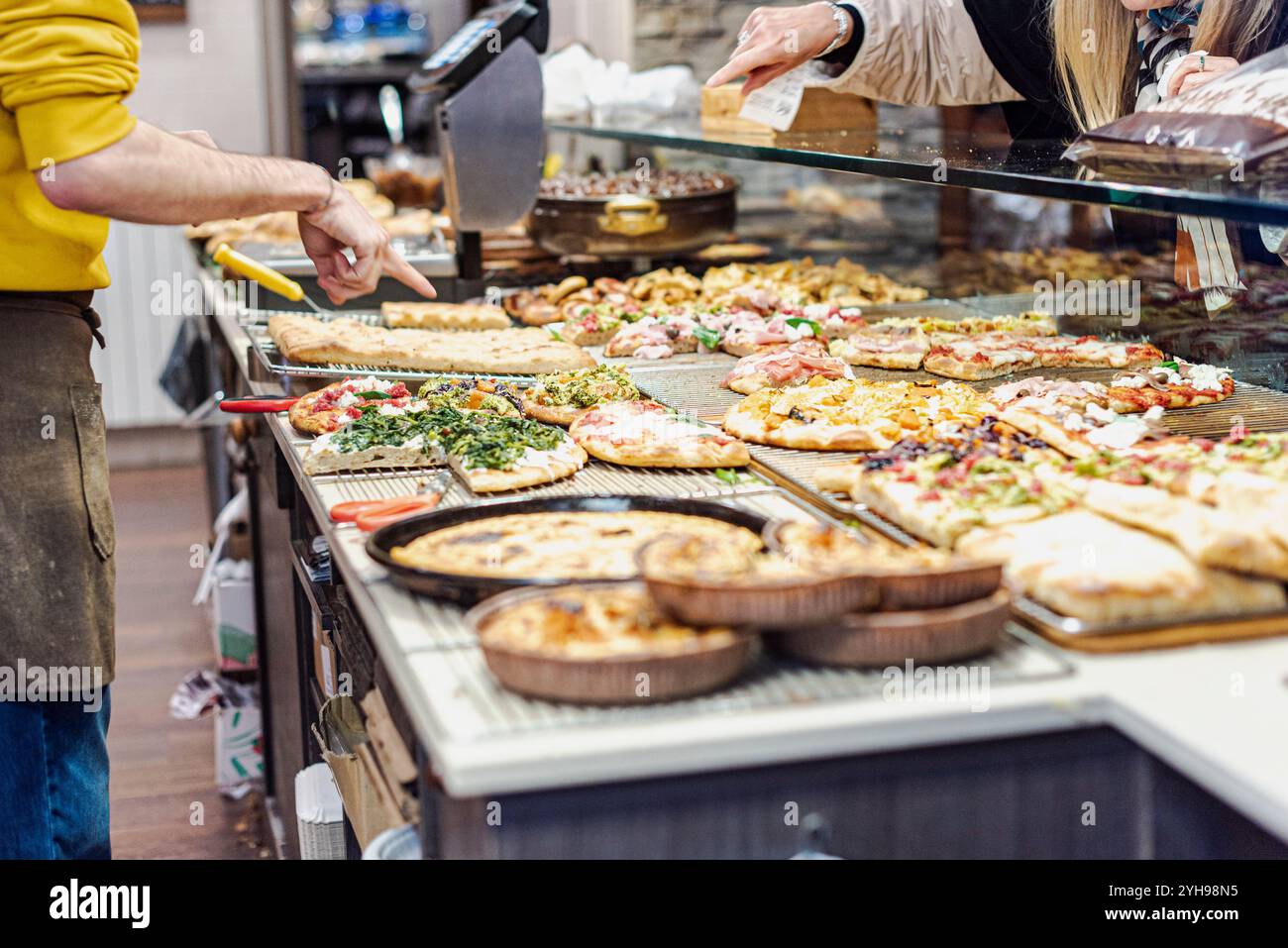 Cutting pizza in bakery hi-res stock photography and images - Alamy