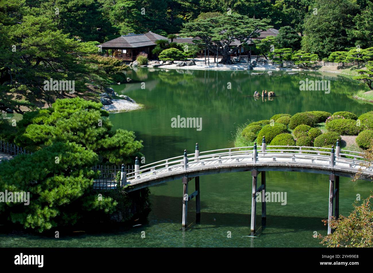 Engetsu arched bridge over Nanko pond with the Kikugetsutei tea house ...