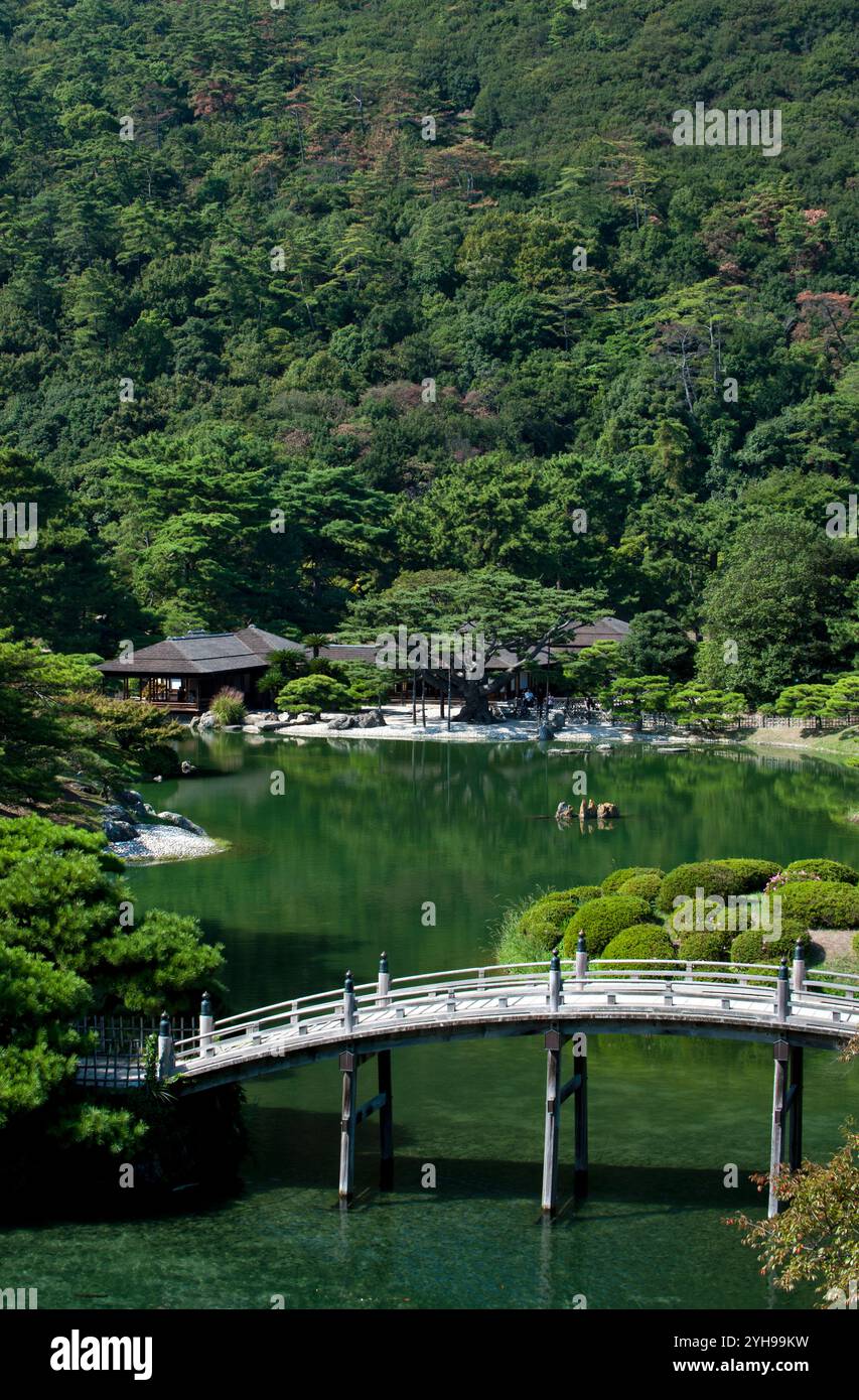 Engetsu arched bridge over Nanko pond with the Kikugetsutei tea house ...