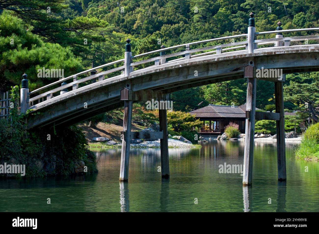 Engetsu arched bridge over Nanko pond with the Kikugetsutei tea house ...