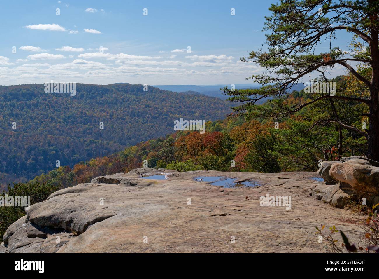 Standing at the rock edge on the cliff of Bee rock at the overlook ...