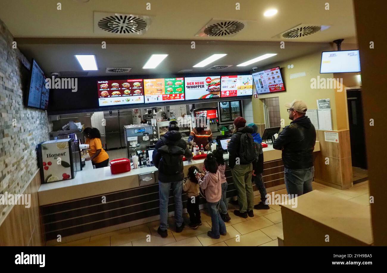Burger King restaurant customers wait for their food to be prepared ...