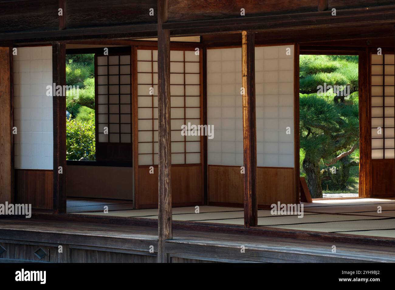 Sliding shoji paper screen panels divide the interior space of the ...