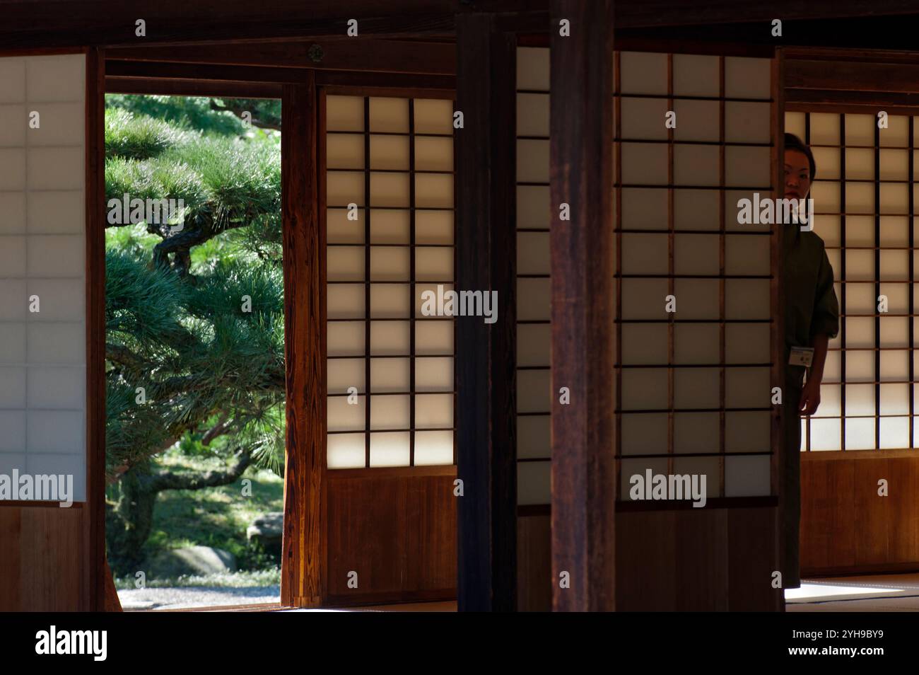 Female servants dressed in traditional kimono seen inside a Japanese ...