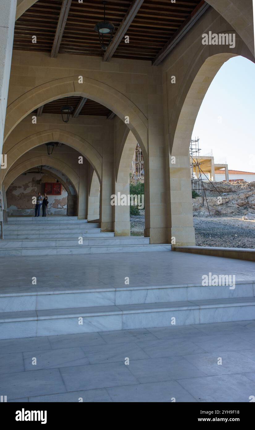 Visitors admire the intricate stone arches while enjoying the serene ...