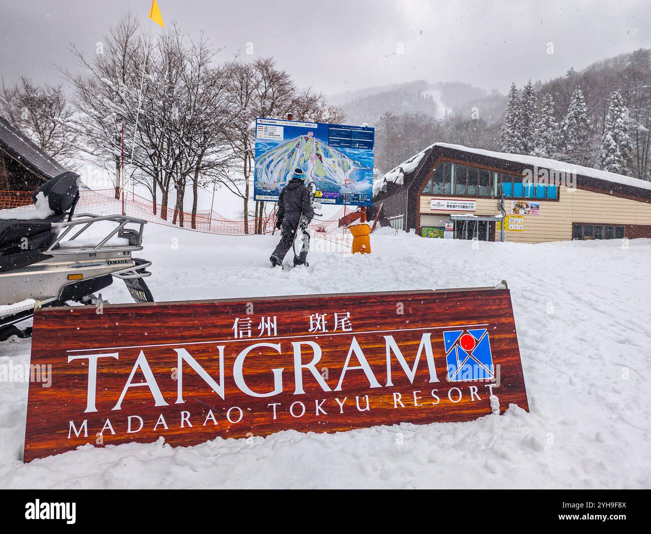 Snowboarders and skiers at the Tangram Madarao Tokyu Resort ski area in ...