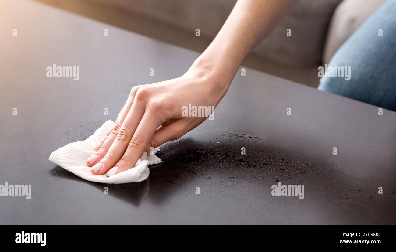 Woman wipes table antiseptic napkin, free space Stock Photo - Alamy