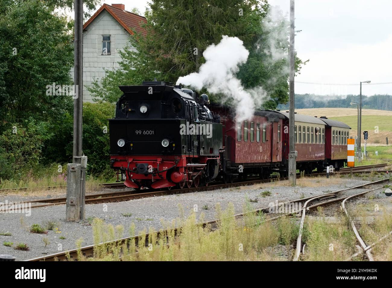 Steam locomotive 99 6001 (2-6-2 tank locomotive) hauling train into ...