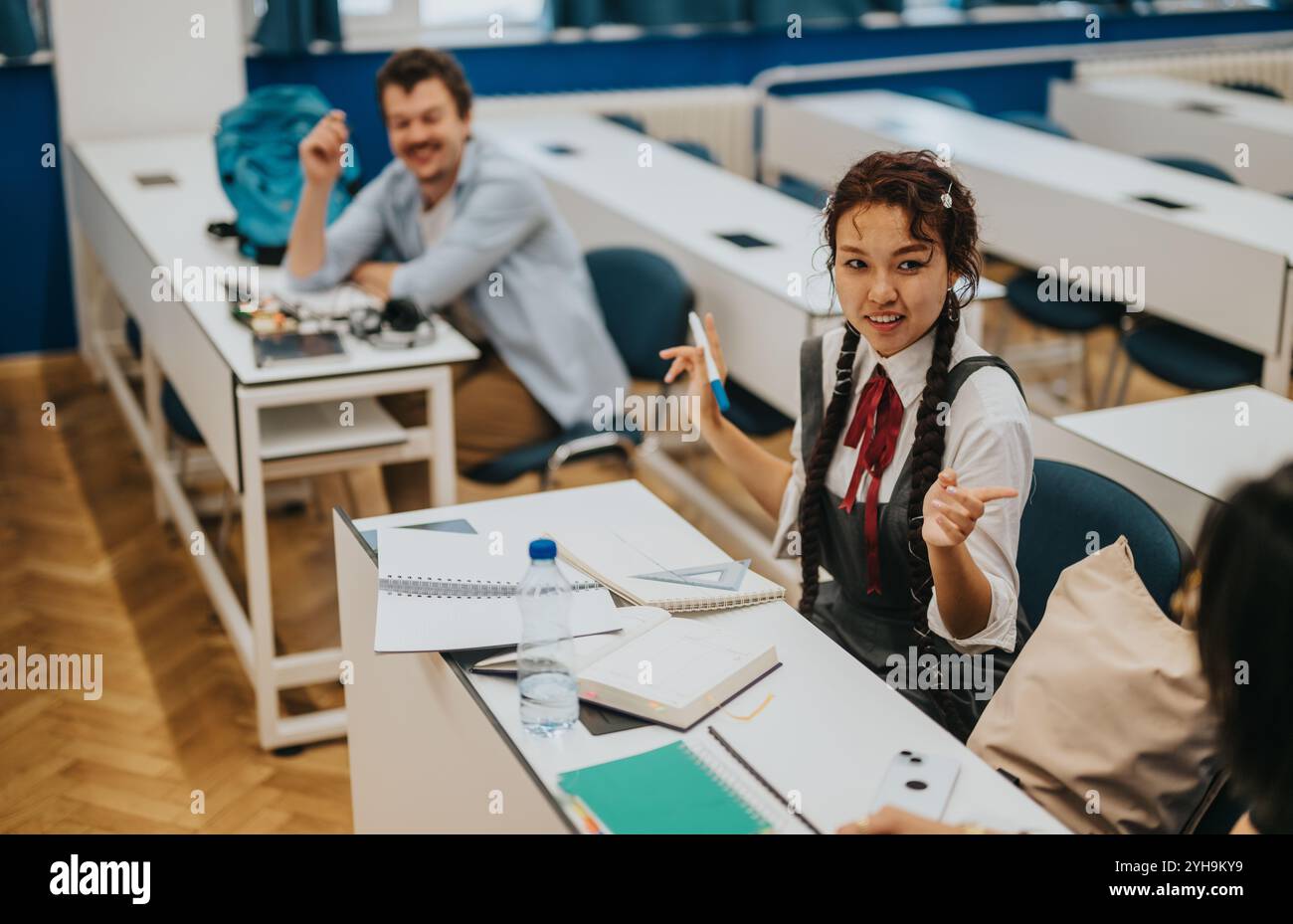Engaged students interacting during a classroom lecture session Stock ...