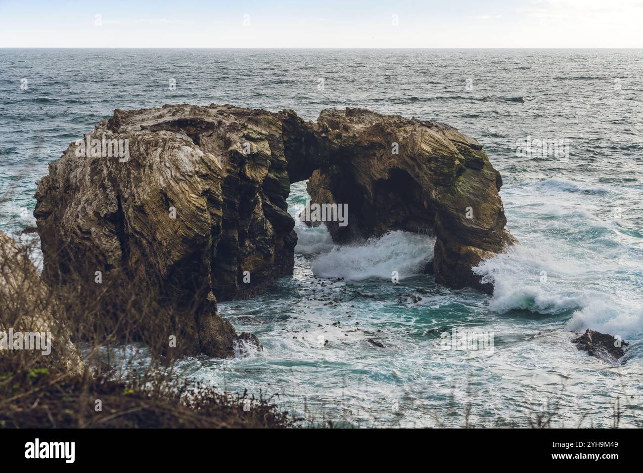 A dramatic beauty of a coastal landscape, with rugged cliffs, and ...