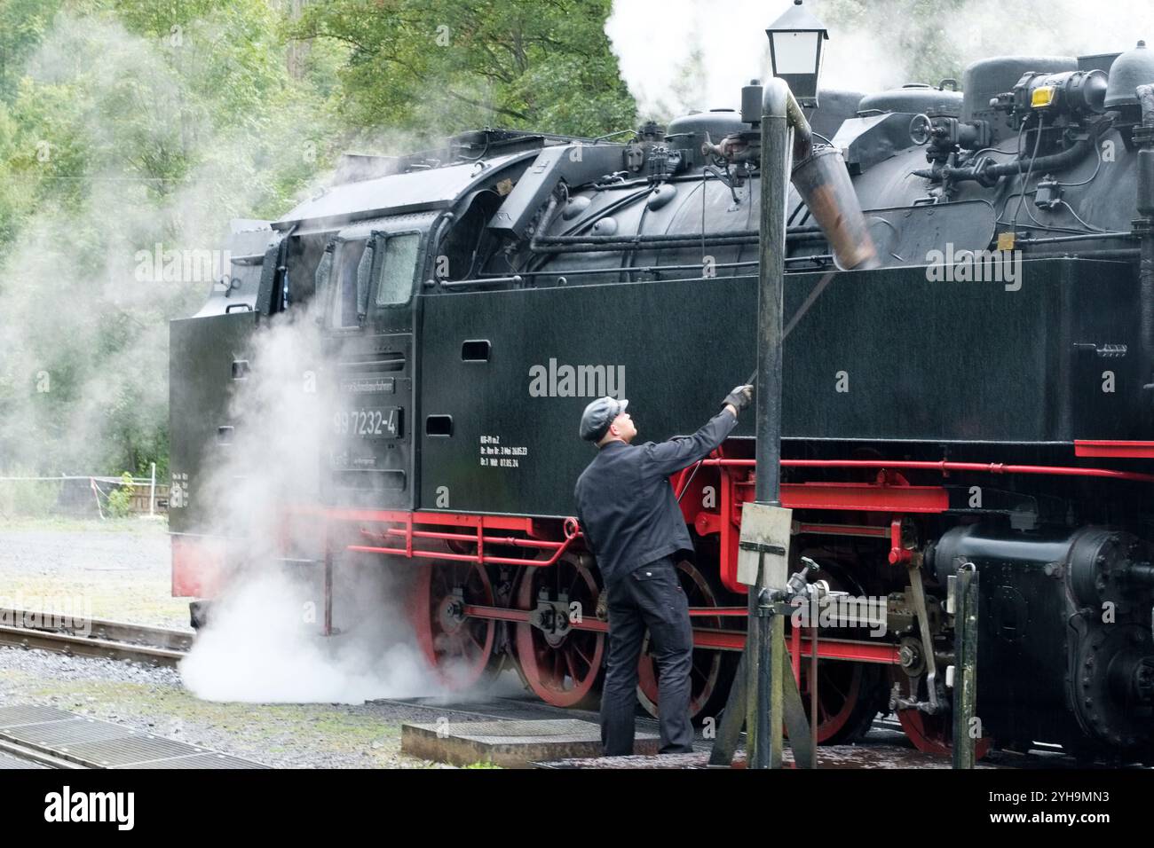 Water stop for 2-10-2 tank locomotive (99231-4) at the junction of ...