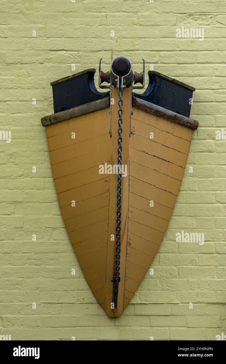 model of the front of a traditional wooden boat being used as a ...