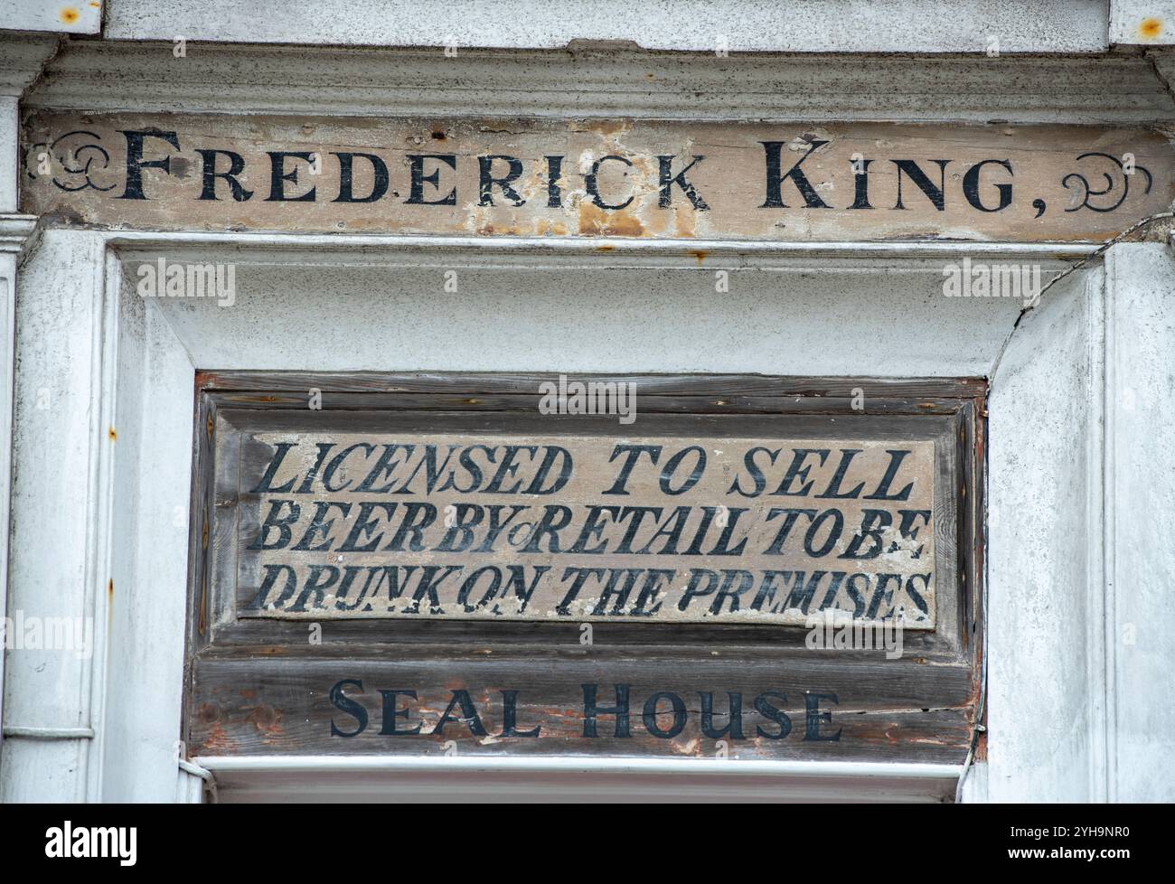 historic writing above the door of an old and now disused public house ...