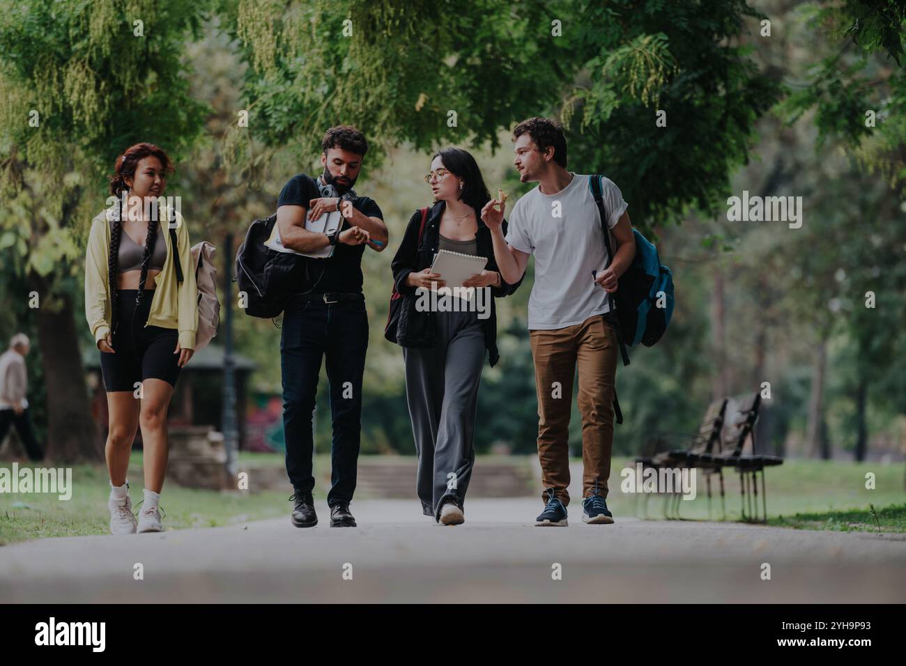 Students enjoying a casual ice cream break with their professor Stock ...