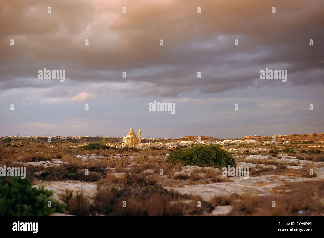 Scenic landscape on Gozo Island, Malta, with distant view of the city ...
