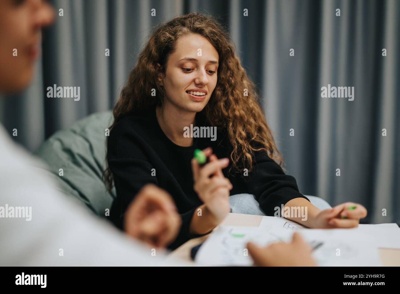 High school students collaboratively working on class assignments Stock Photo - Alamy