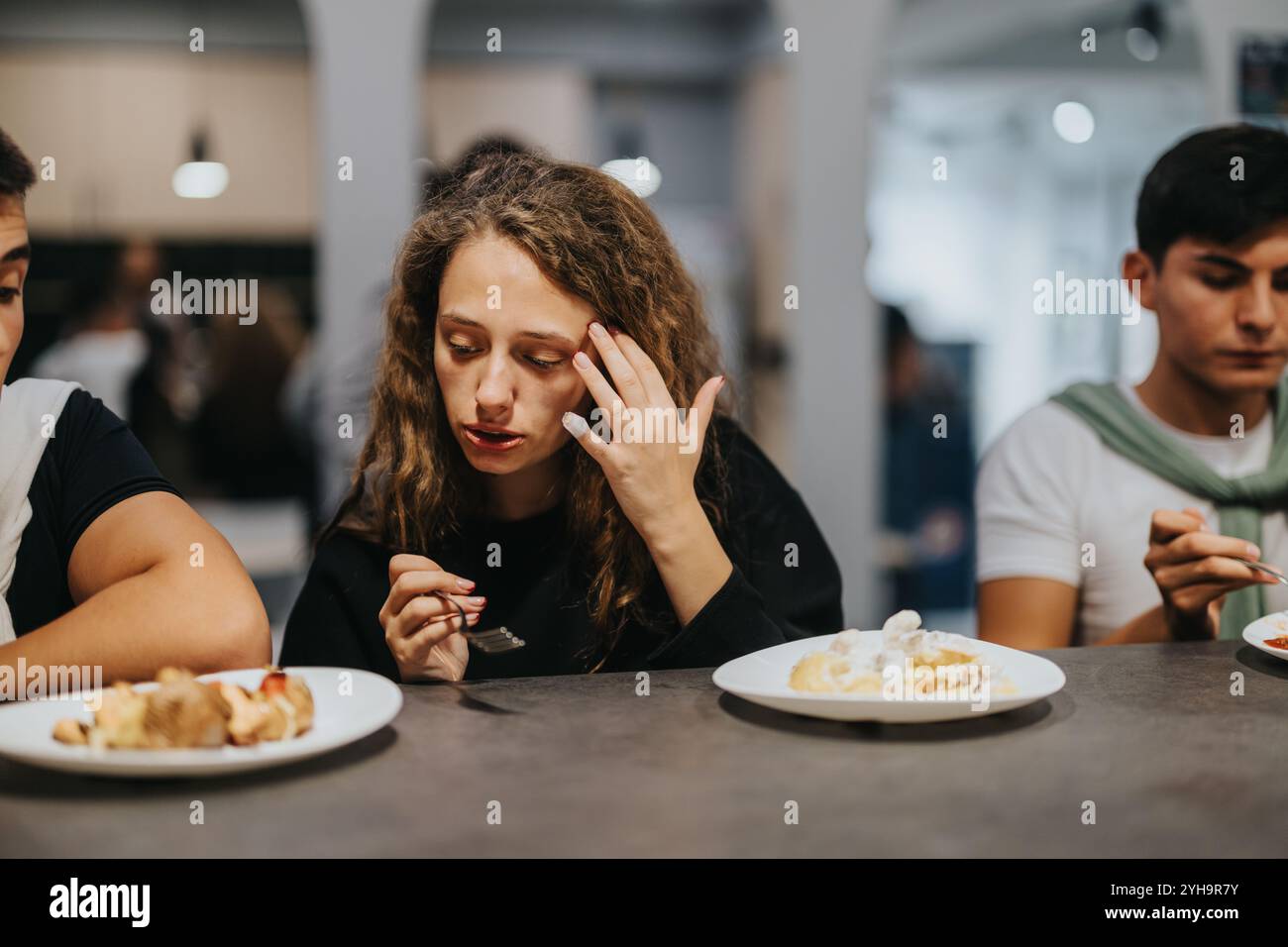 High school students enjoying dessert together at a dining area Stock ...