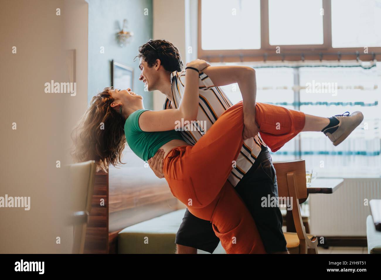 Laughing couple dancing playfully hi-res stock photography and images ...