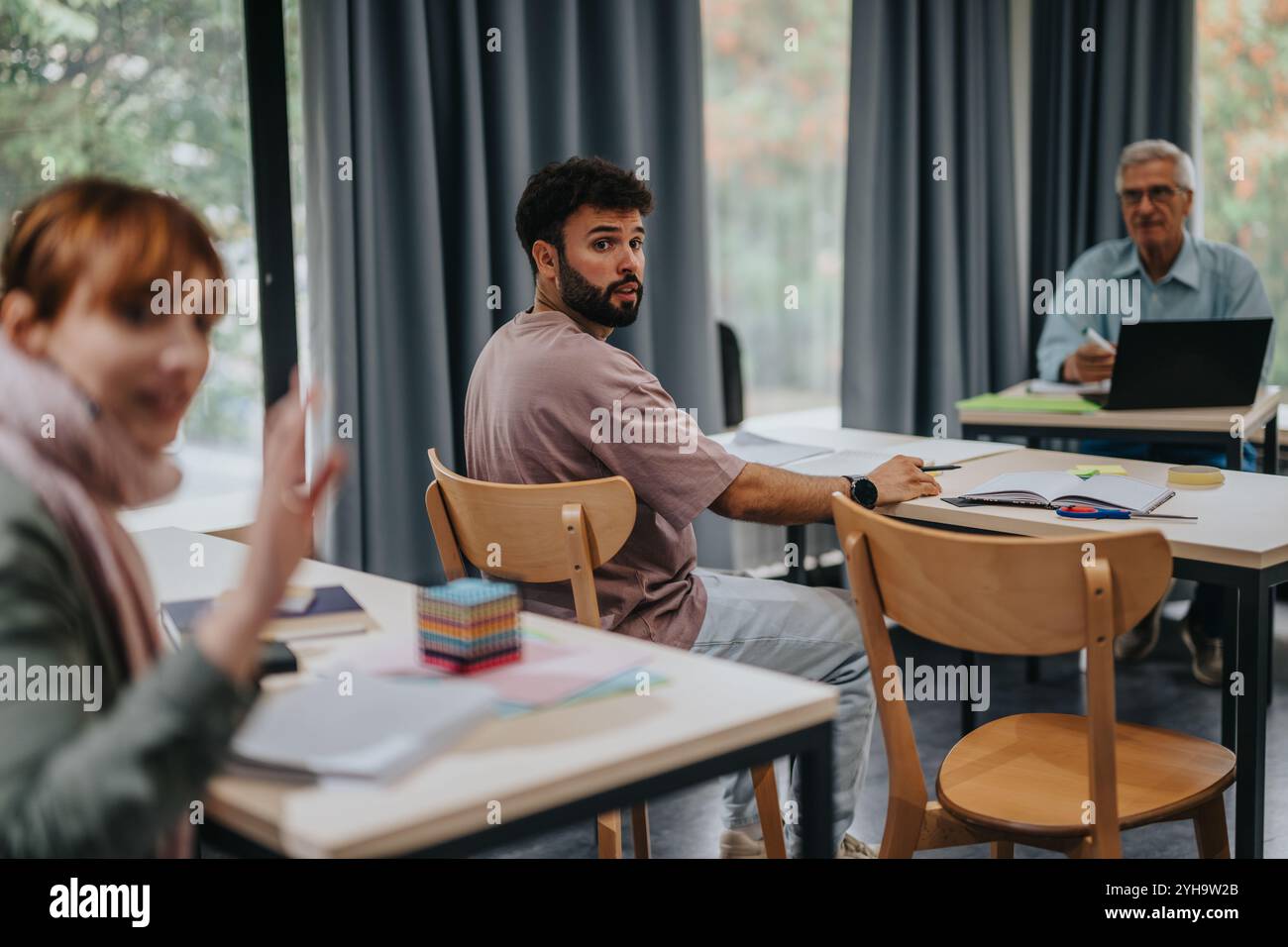 Students engaged in learning at a cozy classroom environment Stock Photo - Alamy