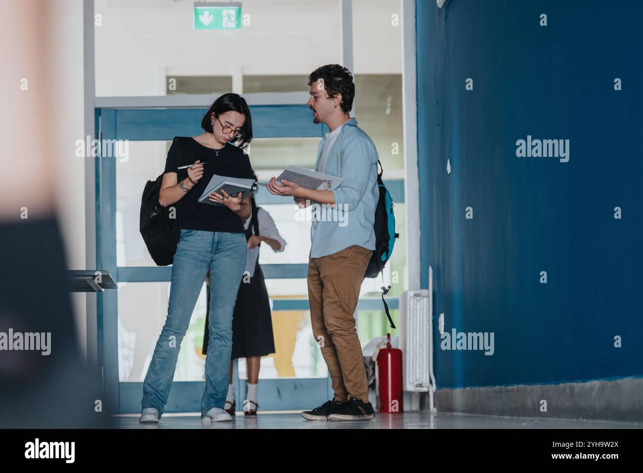 Teacher student talking hallway hi-res stock photography and images - Alamy