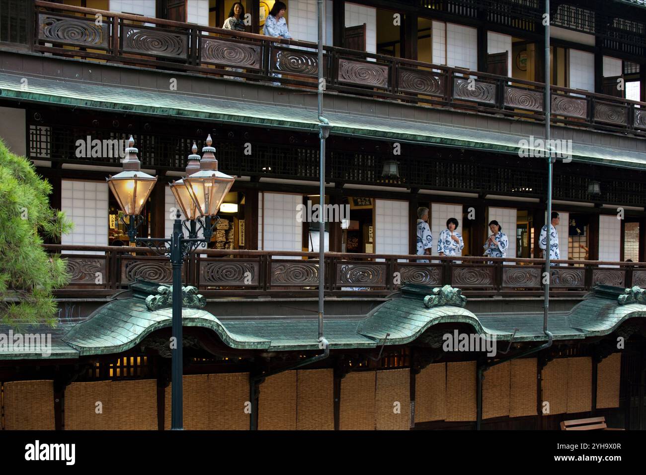 Visitors to the "honkan," or main building, at Dogo Onsen hot spring ...