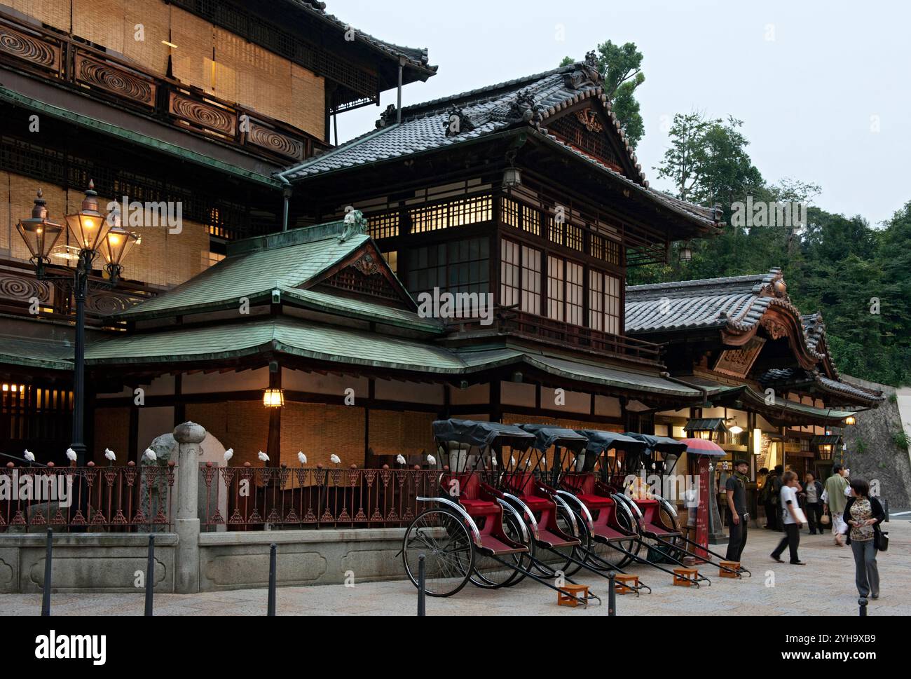 Visitors to the "honkan," or main building, at Dogo Onsen hot spring ...