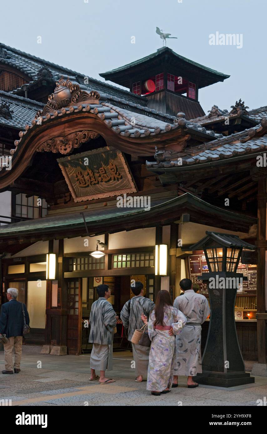 Visitors to the "honkan," or main building, at Dogo Onsen hot spring ...