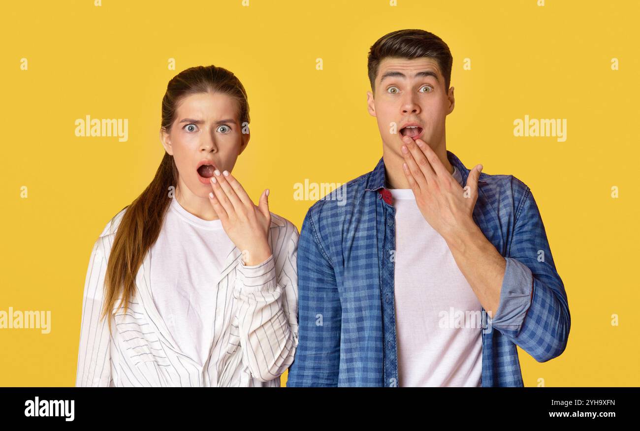 Funny surprised couple see something strange and scared Stock Photo - Alamy