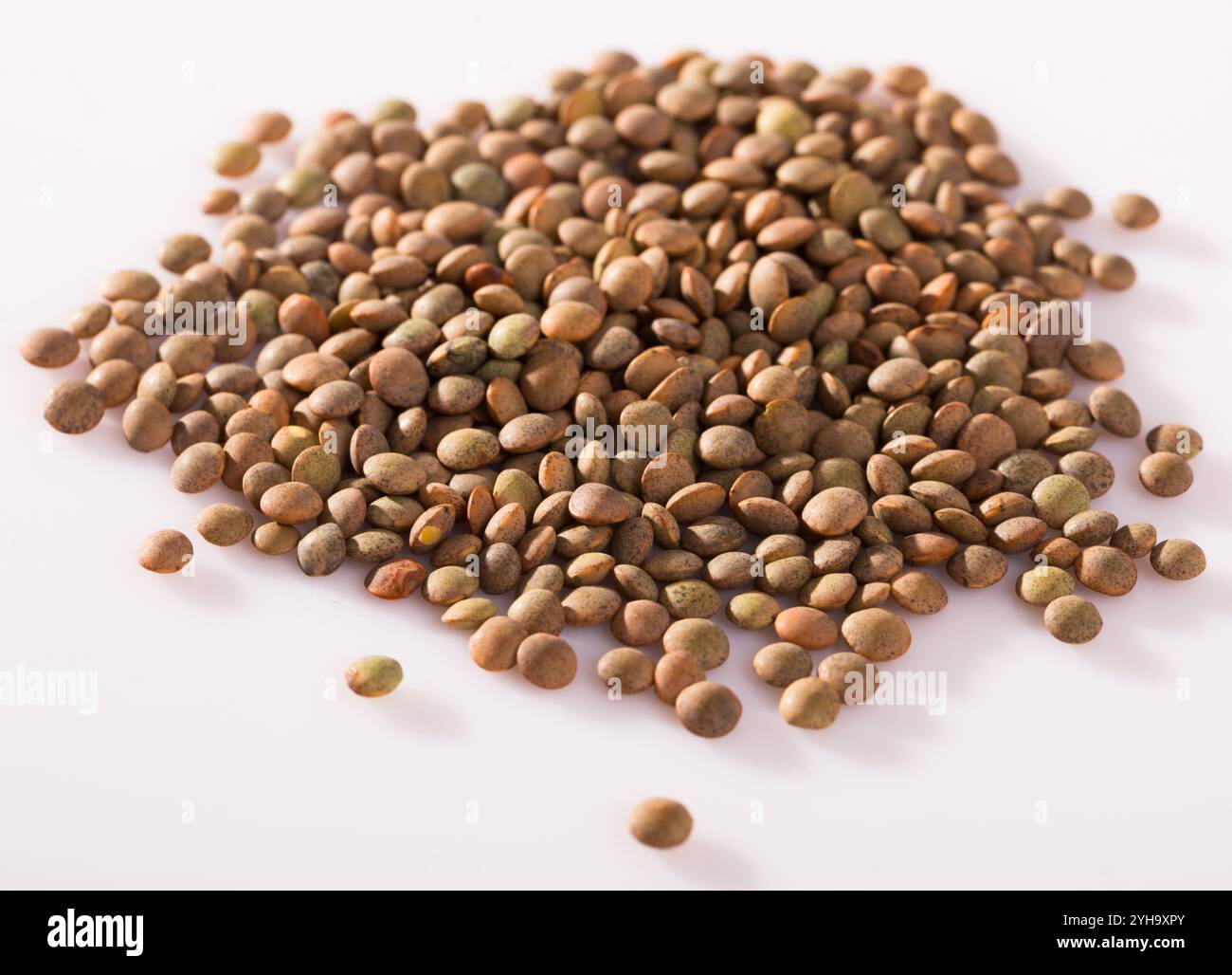 Pile of lentils on white background Stock Photo - Alamy