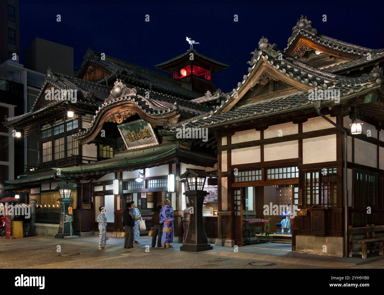 Visitors to the "honkan," or main building, at Dogo Onsen hot spring ...