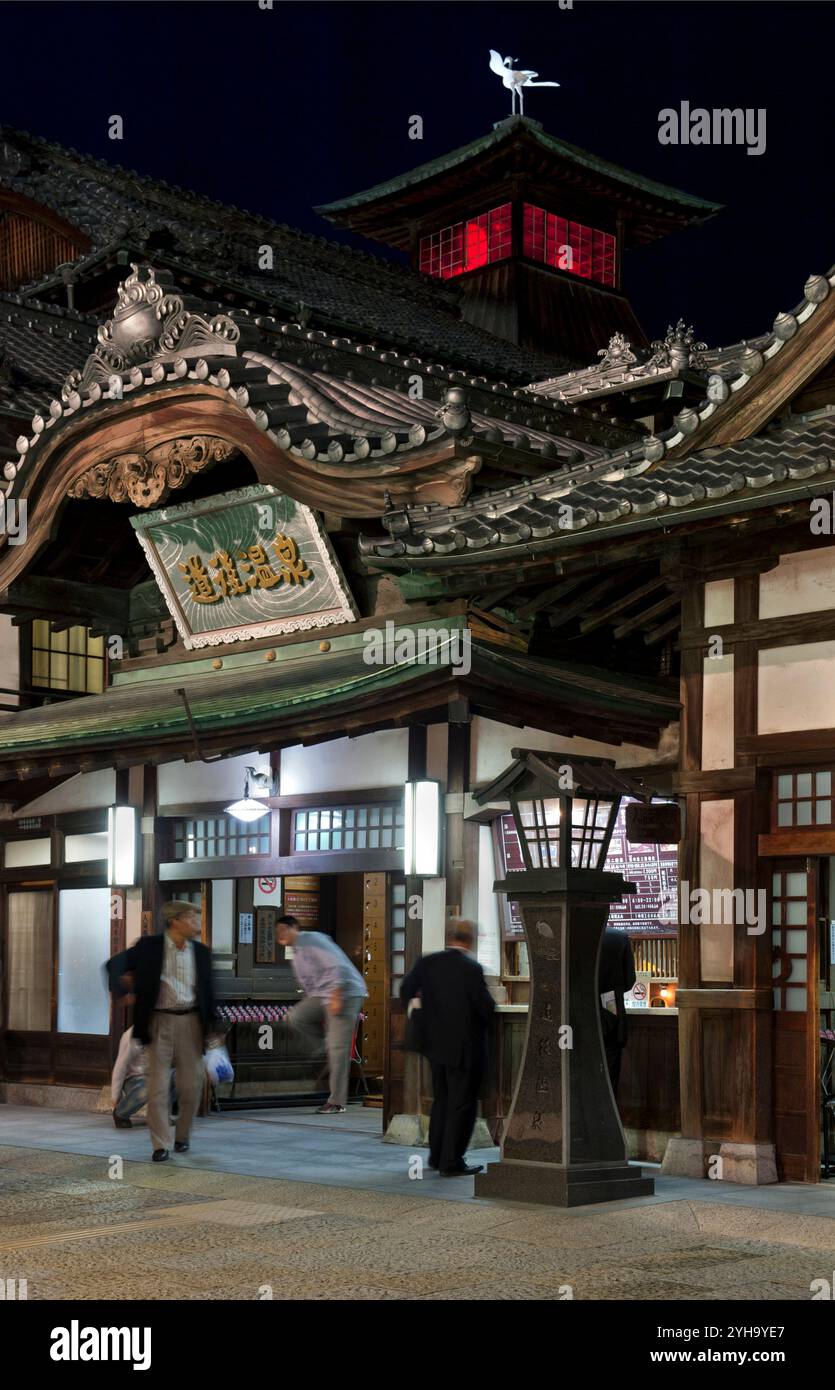 Visitors to the "honkan," or main building, at Dogo Onsen hot spring ...