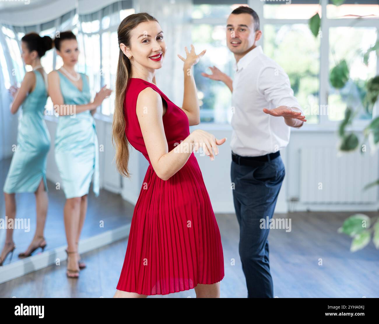 Couple in stage costumes learns boogie woogie dancing during individual ...