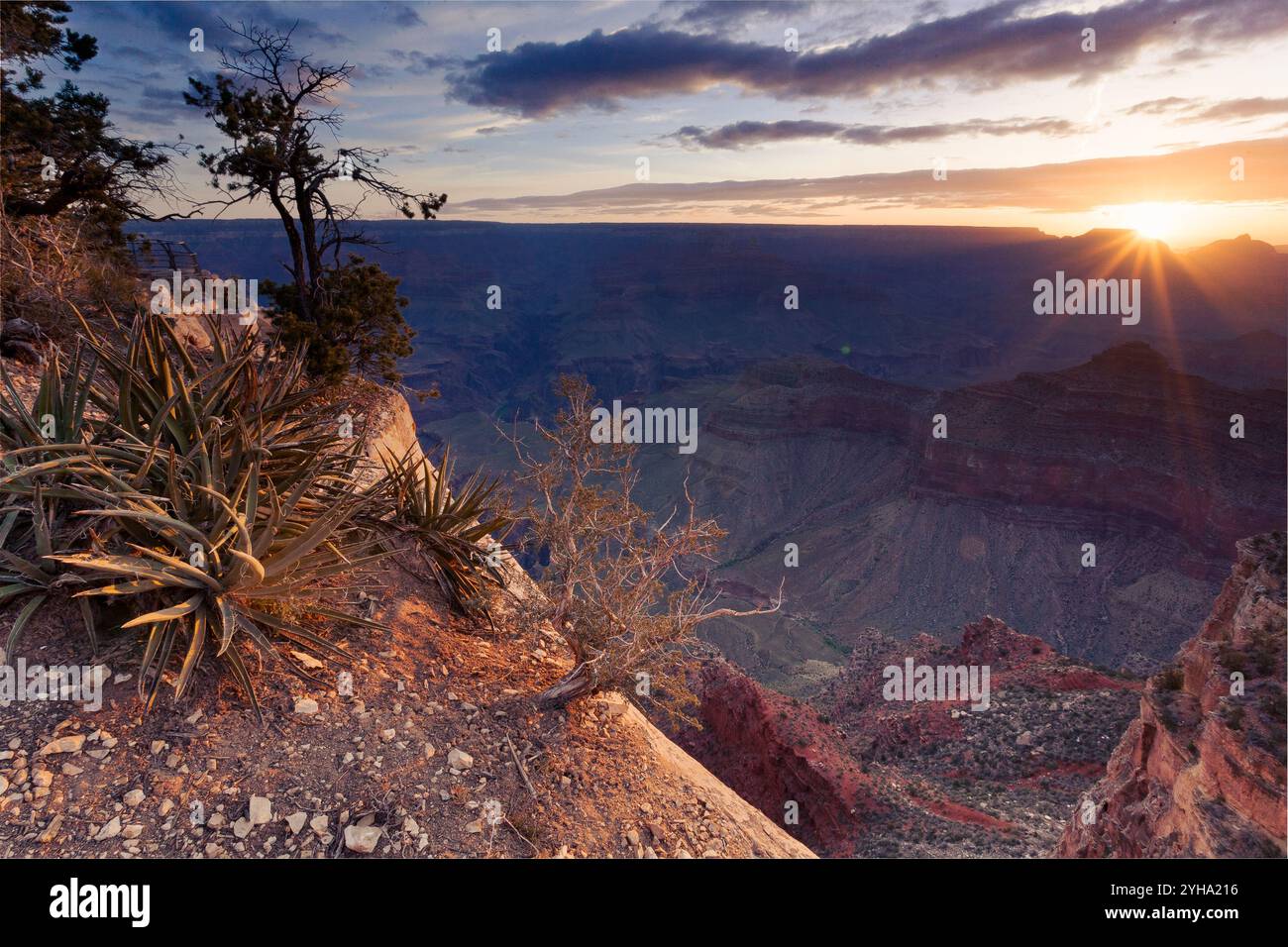 The sun rising beyond the ridges and canyons of the Grand Canyon. Grand ...
