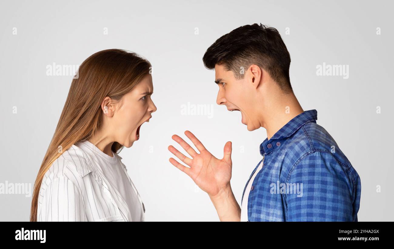 Millennial boyfriend and girlfriend swear and scream Stock Photo - Alamy