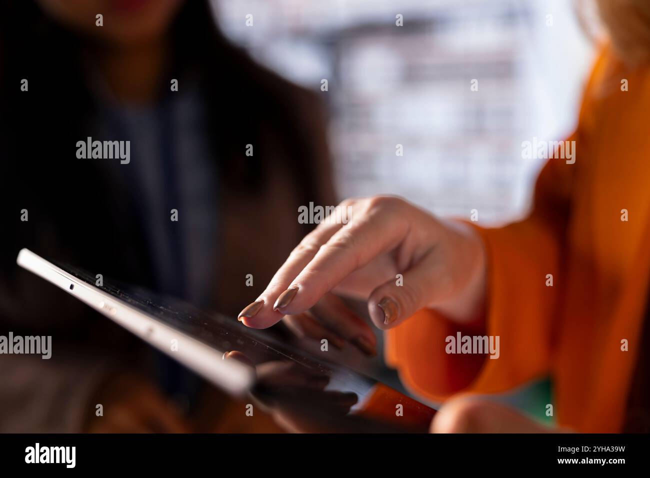 General director reviewing data analytics with her team for successful ...