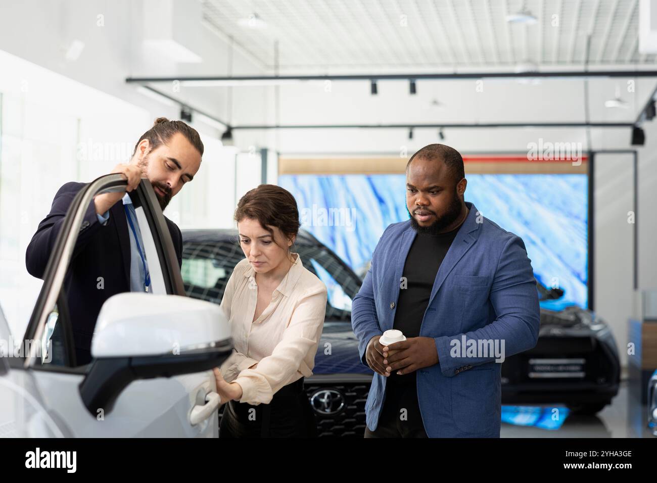 Salesman showing information car hi-res stock photography and images ...