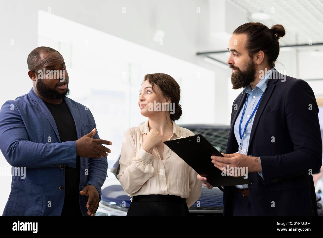 Salesman helping clients choose hi-res stock photography and images - Alamy