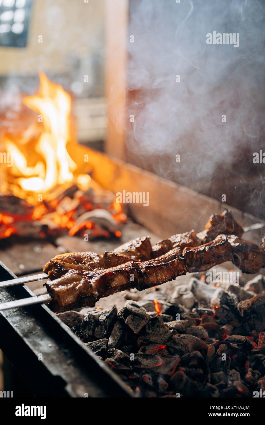 Sizzling seasoned meat over charcoal hi-res stock photography and ...