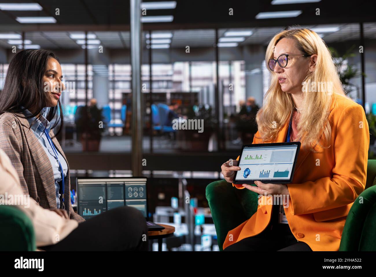 Diverse business leaders in a meeting sharing ideas for corporate ...