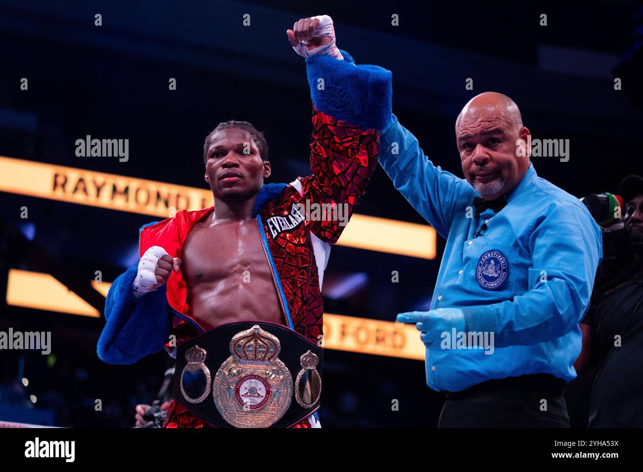 Raymond Ford, left, gets his arm raised for winning against Orlando ...