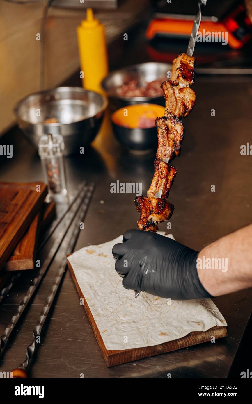 Delicious grilled skewer placed on lavash, ready to serve. Perfect for ...