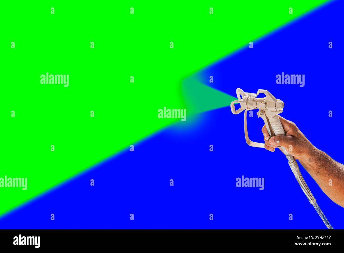 Professional Spray Painter Holding Spray Gun Spraying Surface Against ...